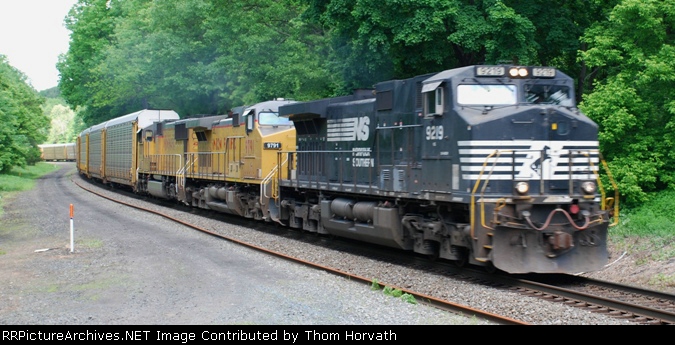 A late running NS 212 approaches the grade crossing at 12:29